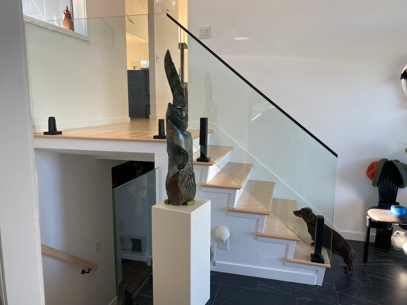Glass railing with top rail mounted with Standoffs. Matte black finish ...