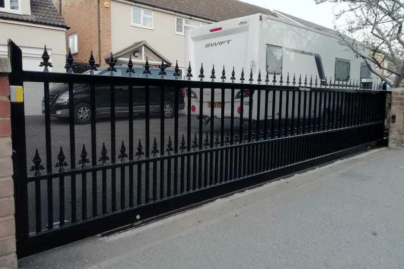 Automated Sliding Drive Gate with wire mesh - Alpha Ironwork Ltd