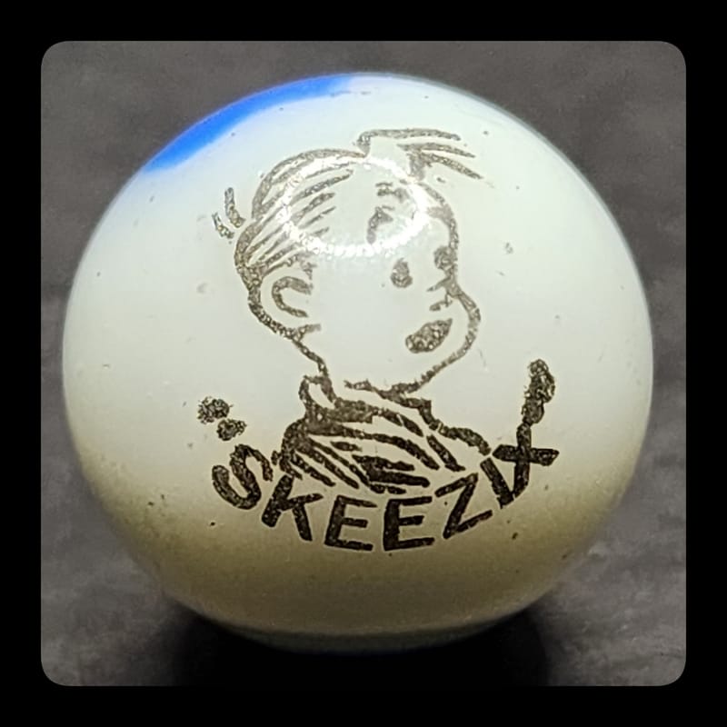 11/16"- Peltier "Skeezix" Comic Picture Marble MINT - Mic'sMibs
